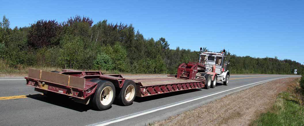 Water Tank Transportation: Best Practices for Secure Hauling | Heavy ...